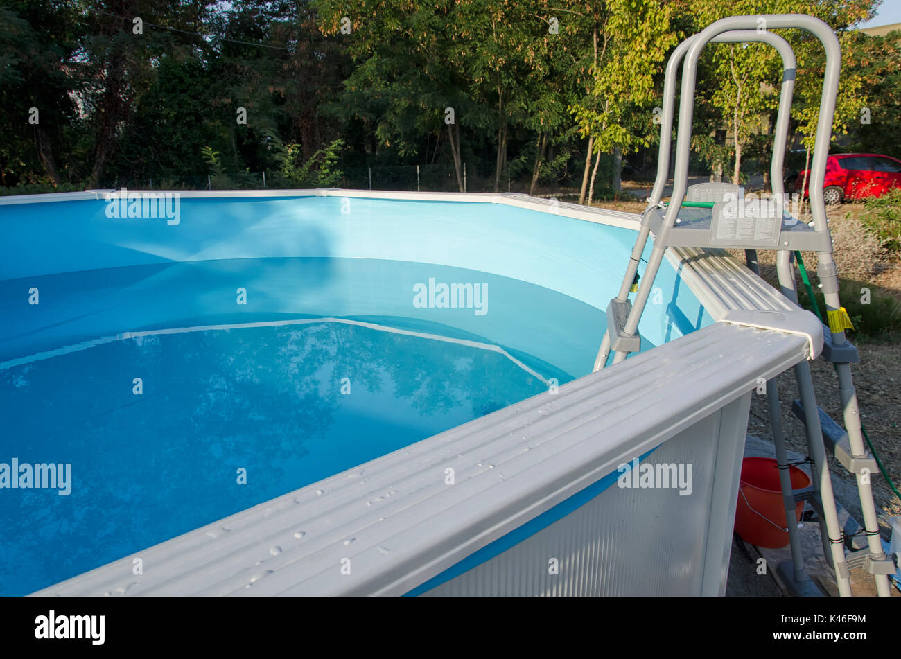 View of metal frame swimming pool ready for a bath Stock Photo - Alamy