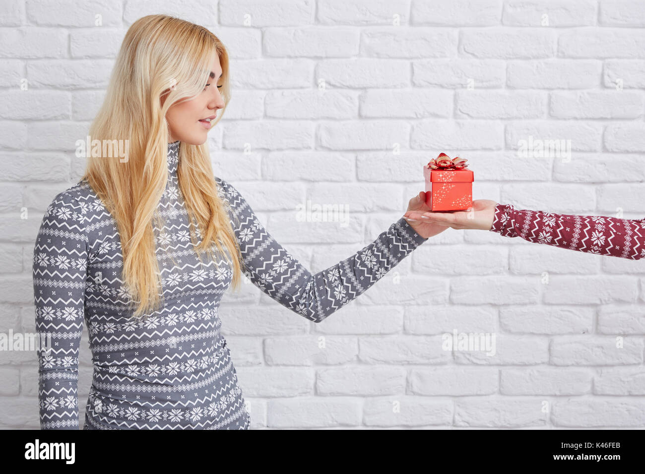 Side portrait of beautiful woman getting present Stock Photo - Alamy