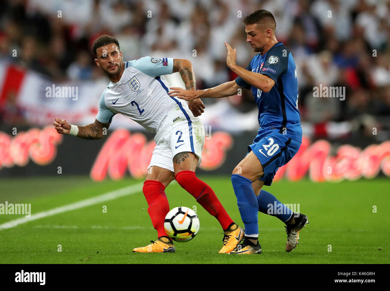 England's Kyle Walker (left) and Slovakia's Robert Mak in action Stock ...