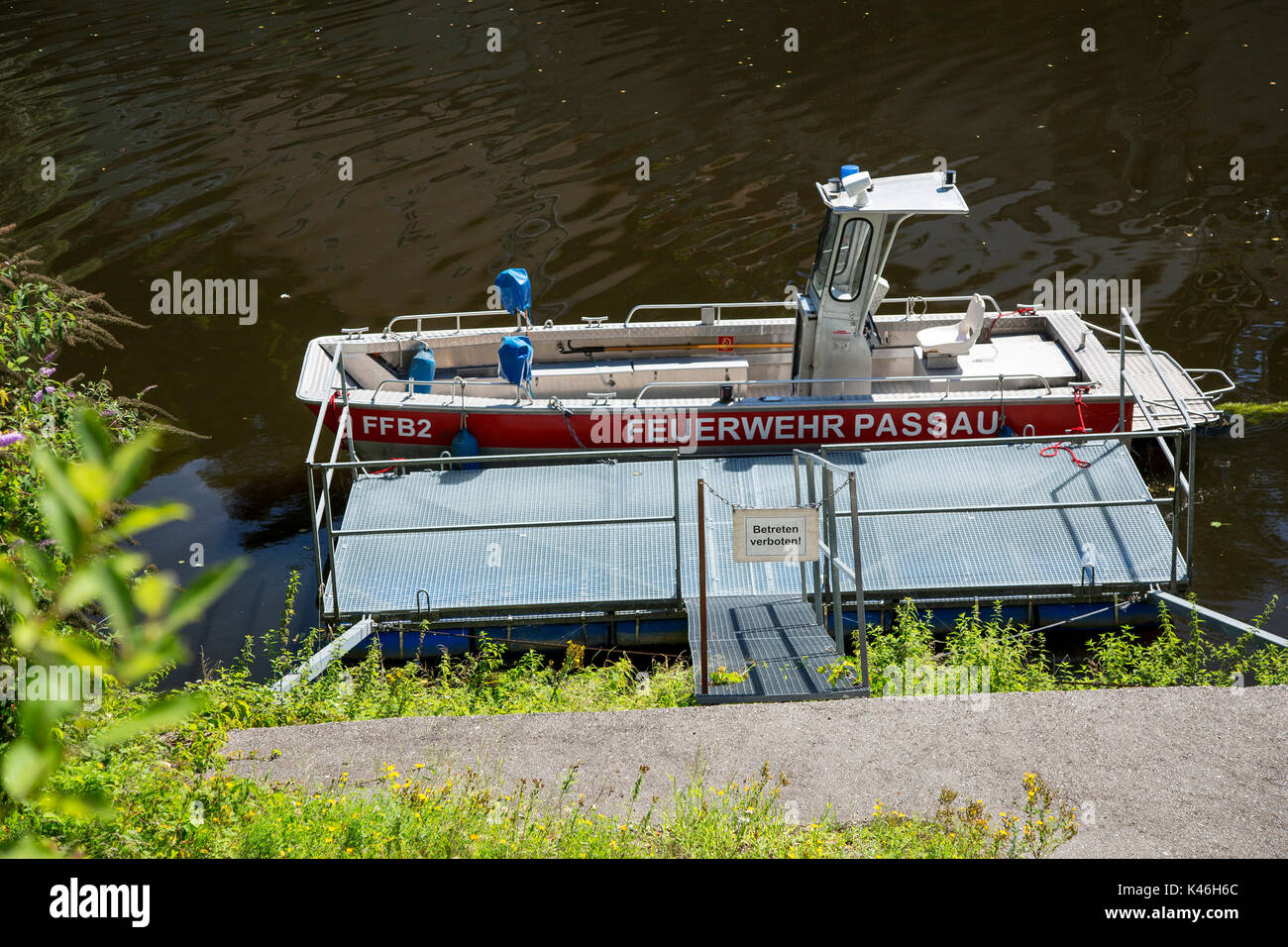 A fire service (Feuerwehr) river rescue boat moored on the river Danube ...