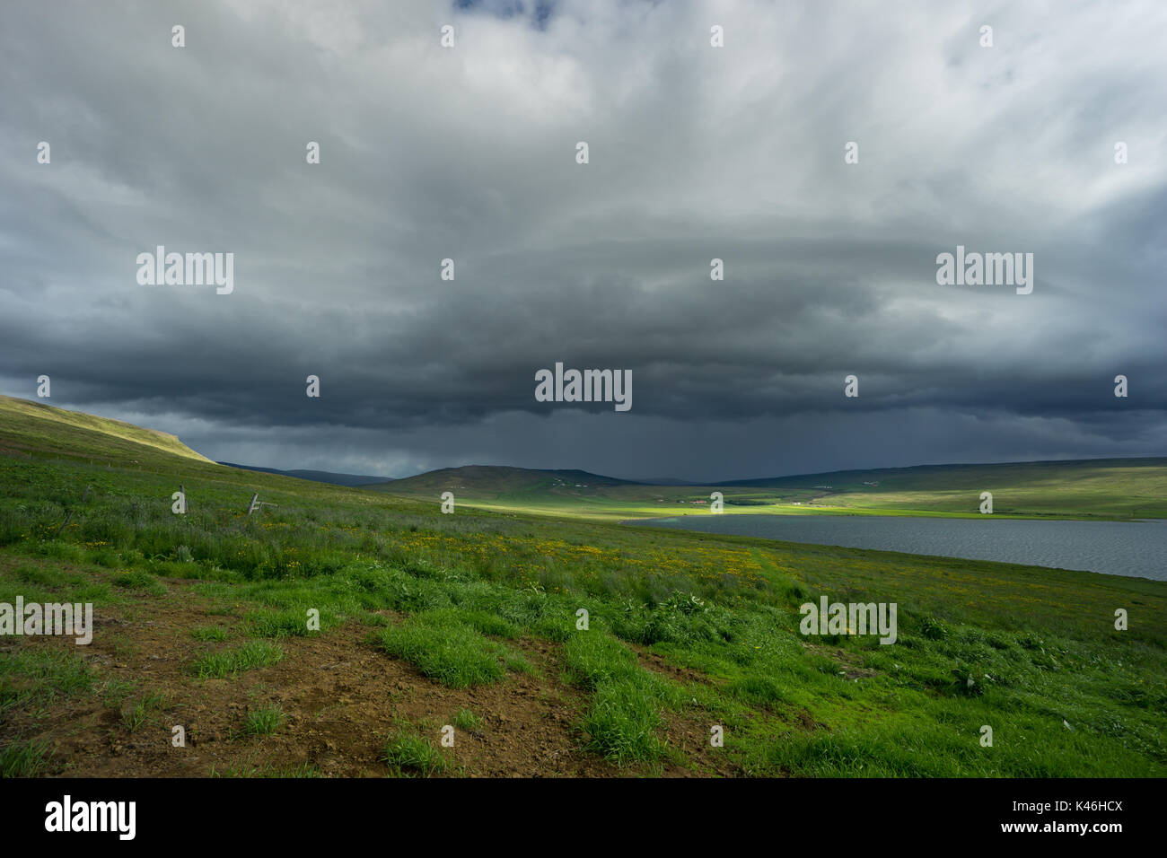 Iceland - Dramatic sky with dark clouds and thunderstorm coming over ...