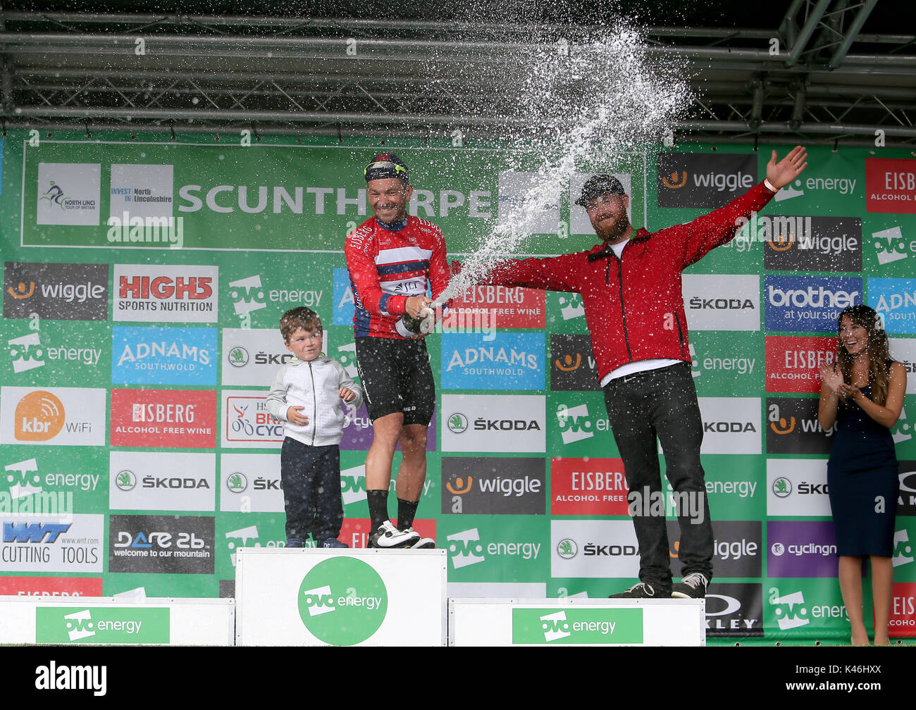 Graham Briggs of Team JLT Condor sprays champagne with his son after ...