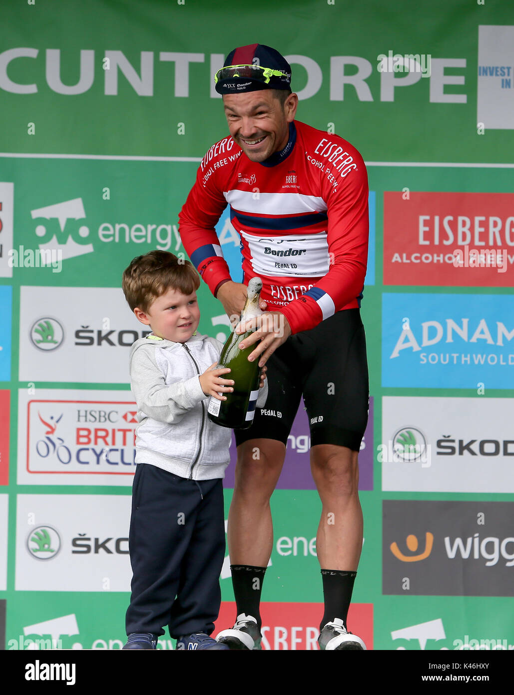 Graham Briggs of Team JLT Condor with his son after stage three of the ...