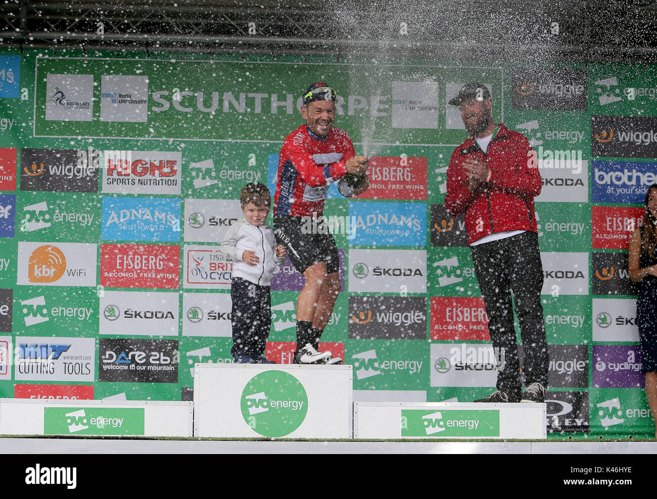 Graham Briggs of Team JLT Condor celebrates with his son after stage ...