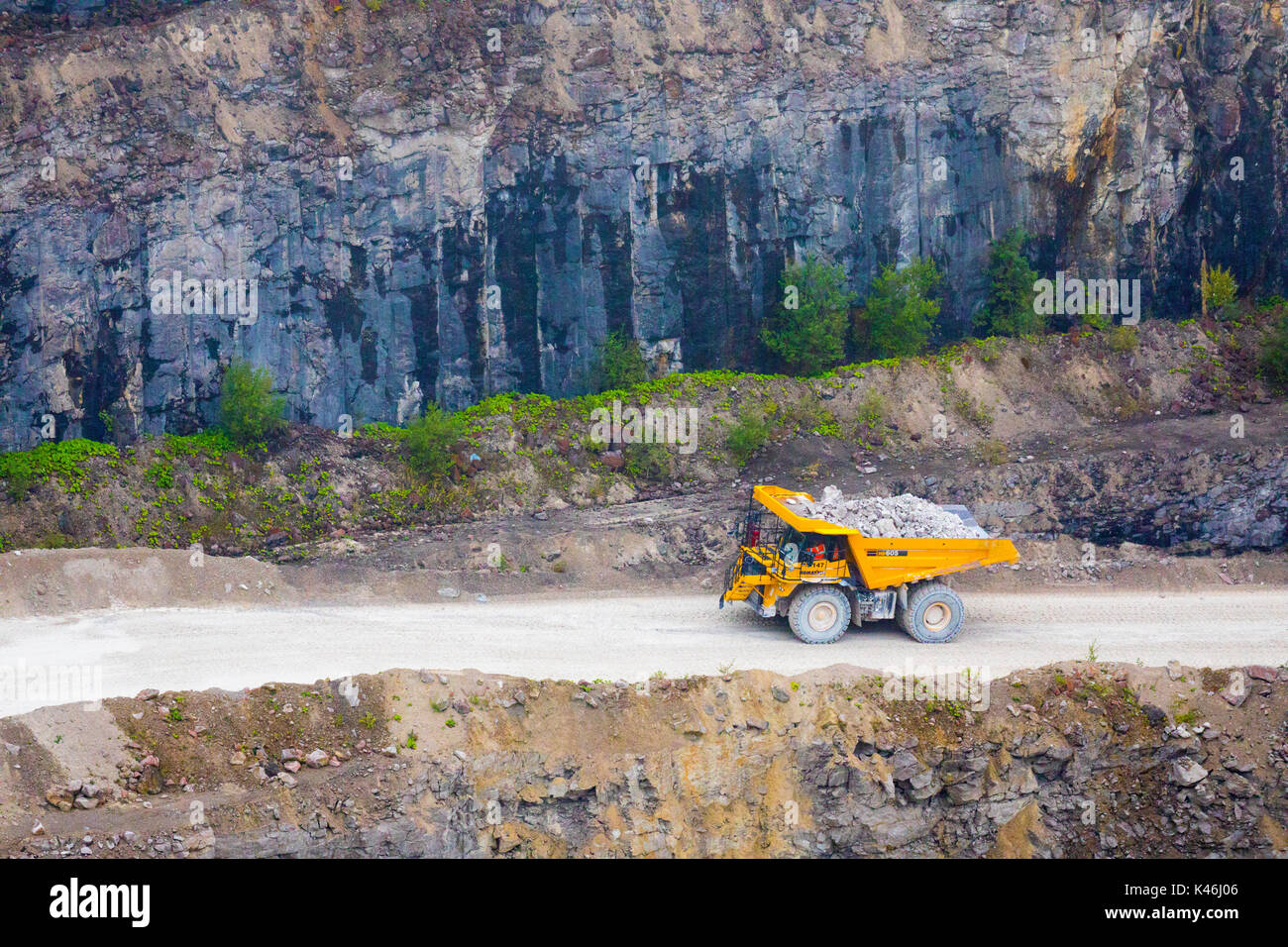 Quarry vehicle dwarfed by the shear expanse and size of Halkyn Quarry ...