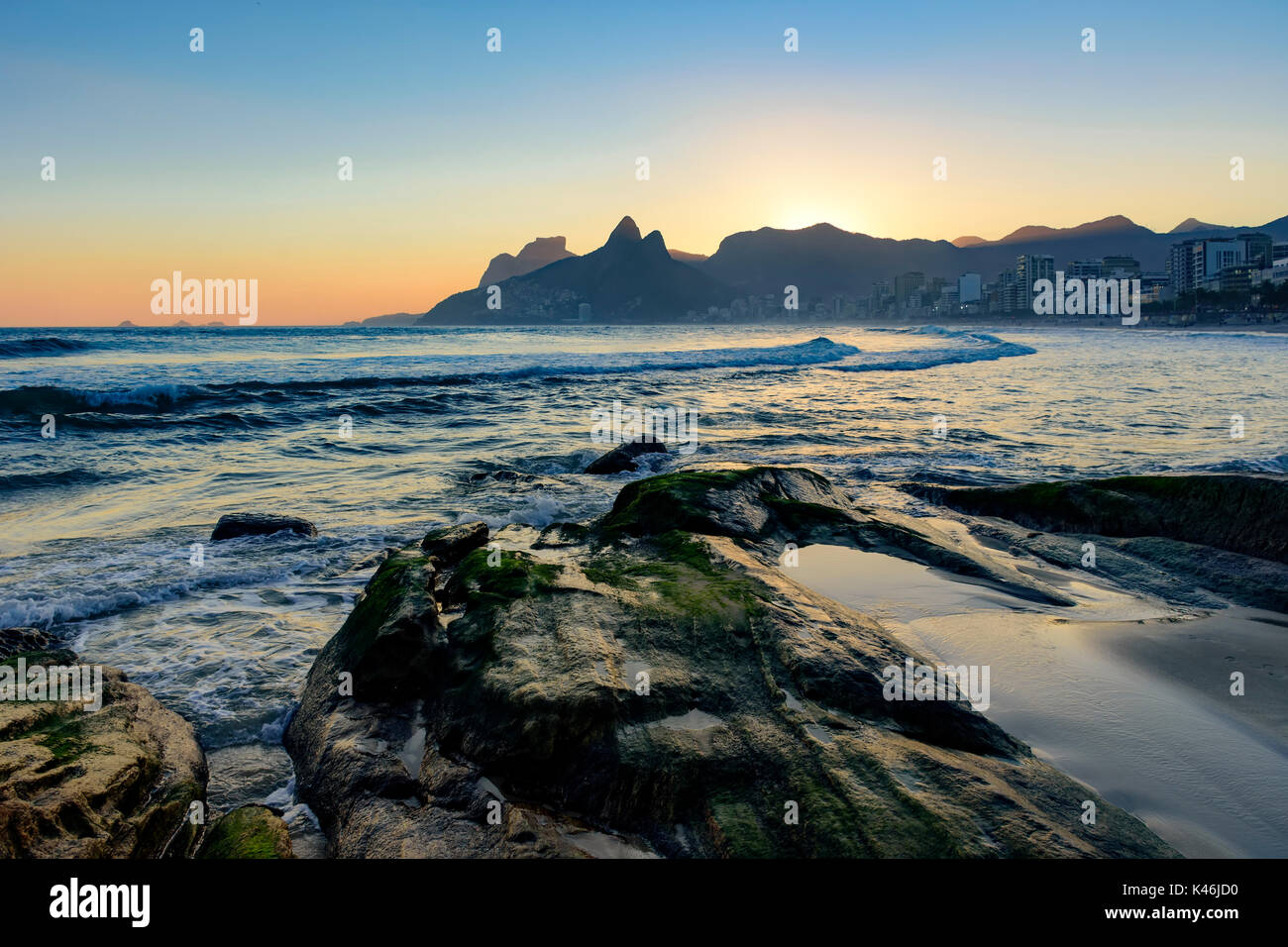 Summer sunset and stones at Ipanema beach in Rio de Janeiro Stock Photo ...