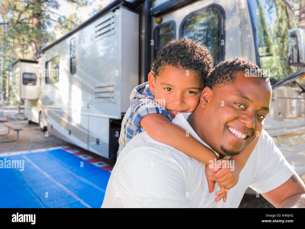 African American Father With Mixed Race Son In Front of Their Beautiful ...