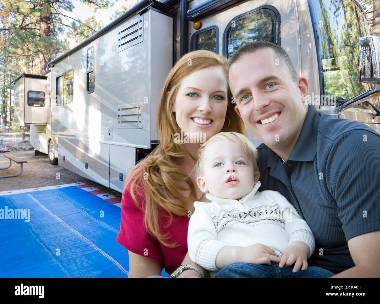 Happy Young Military Family In Front of Their Beautiful RV At The ...