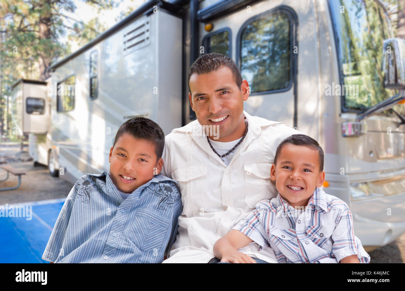 Happy Hispanic Father and Sons In Front of Their Beautiful RV At The ...