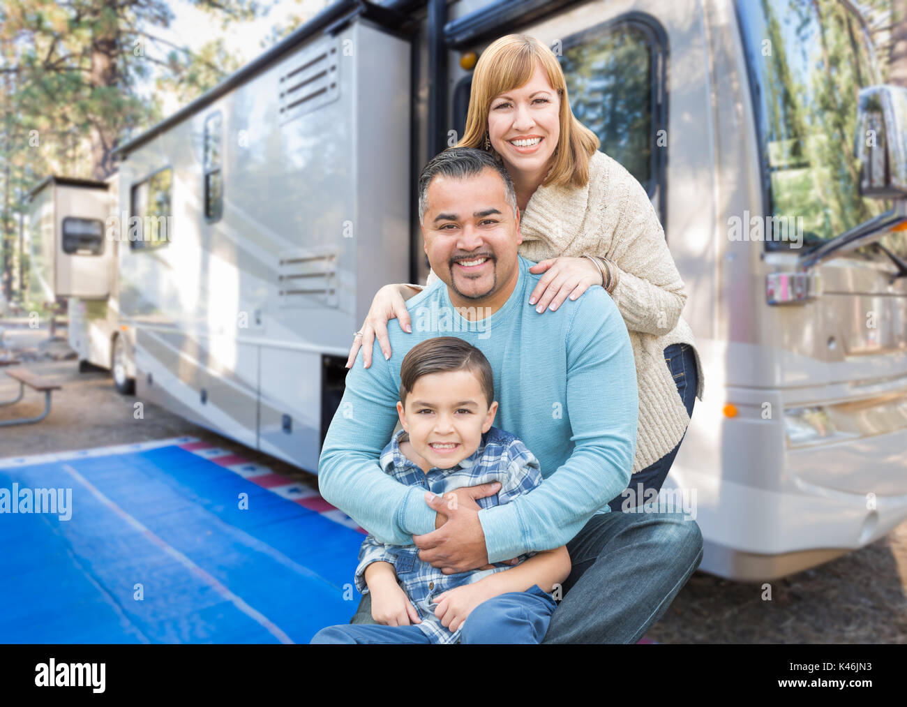 Happy Young Mixed Race Family In Front of Their Beautiful RV At The ...