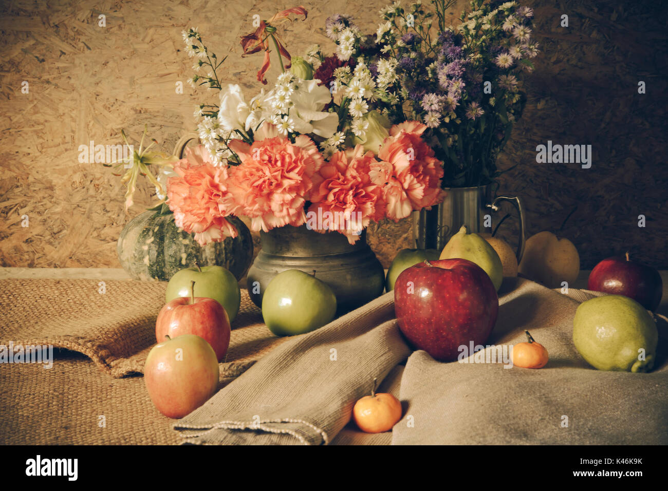 Still life with Fruits were placed together with a vase of flowers ...