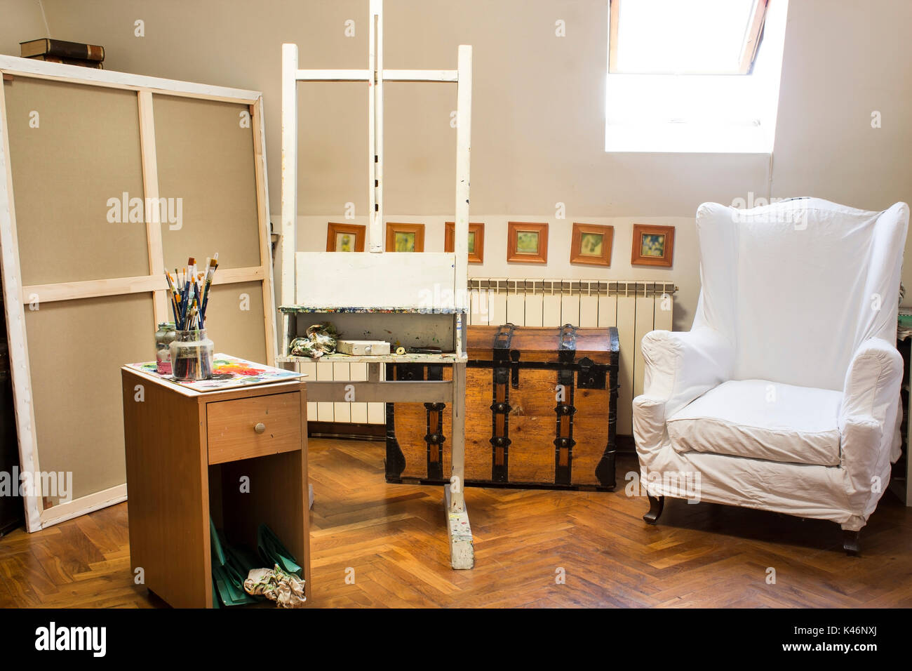 Art studio with paintings and painting equipment Stock Photo - Alamy