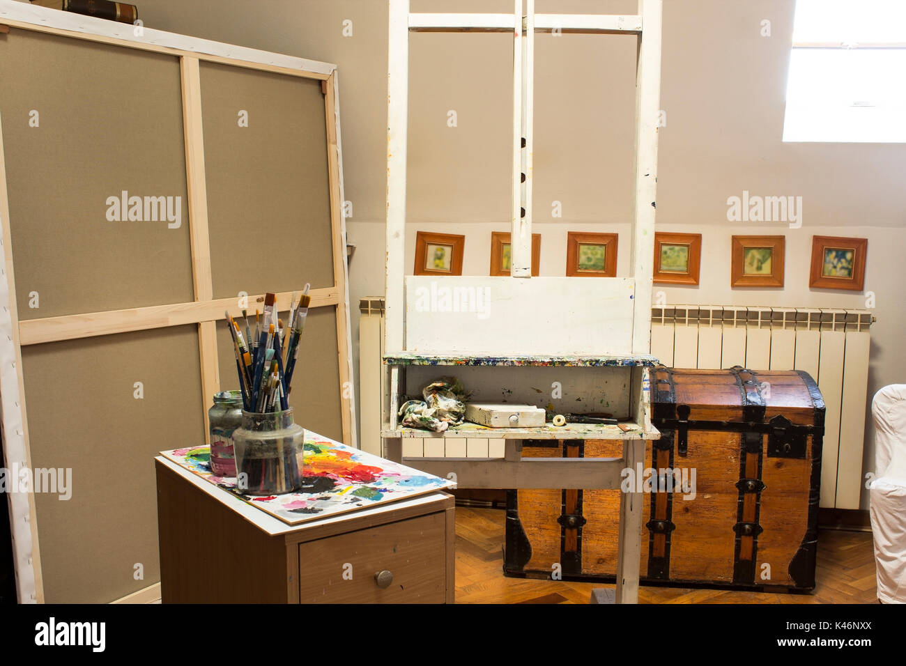 Art studio with paintings and painting equipment Stock Photo - Alamy