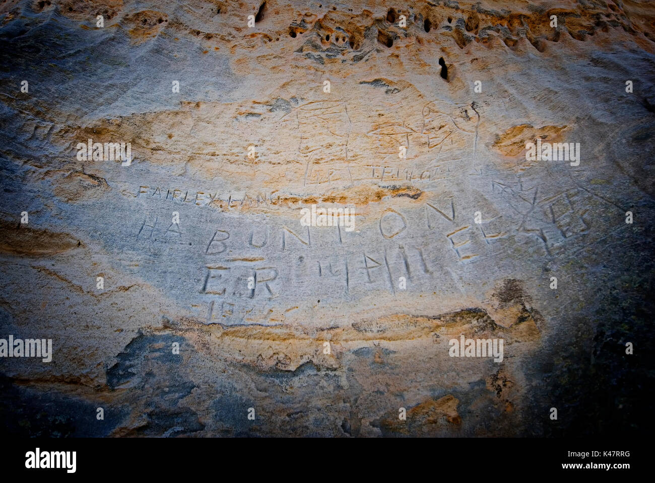 tourist carvings in sandstone rock Mt Moffatt National Park Stock Photo ...