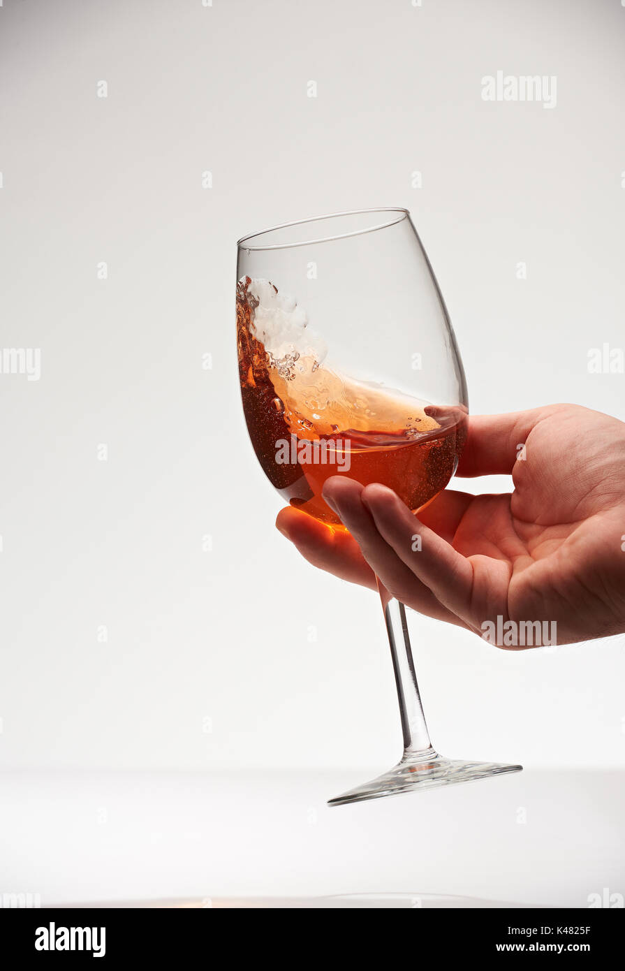 Man hand holding wine glass hi-res stock photography and images - Alamy