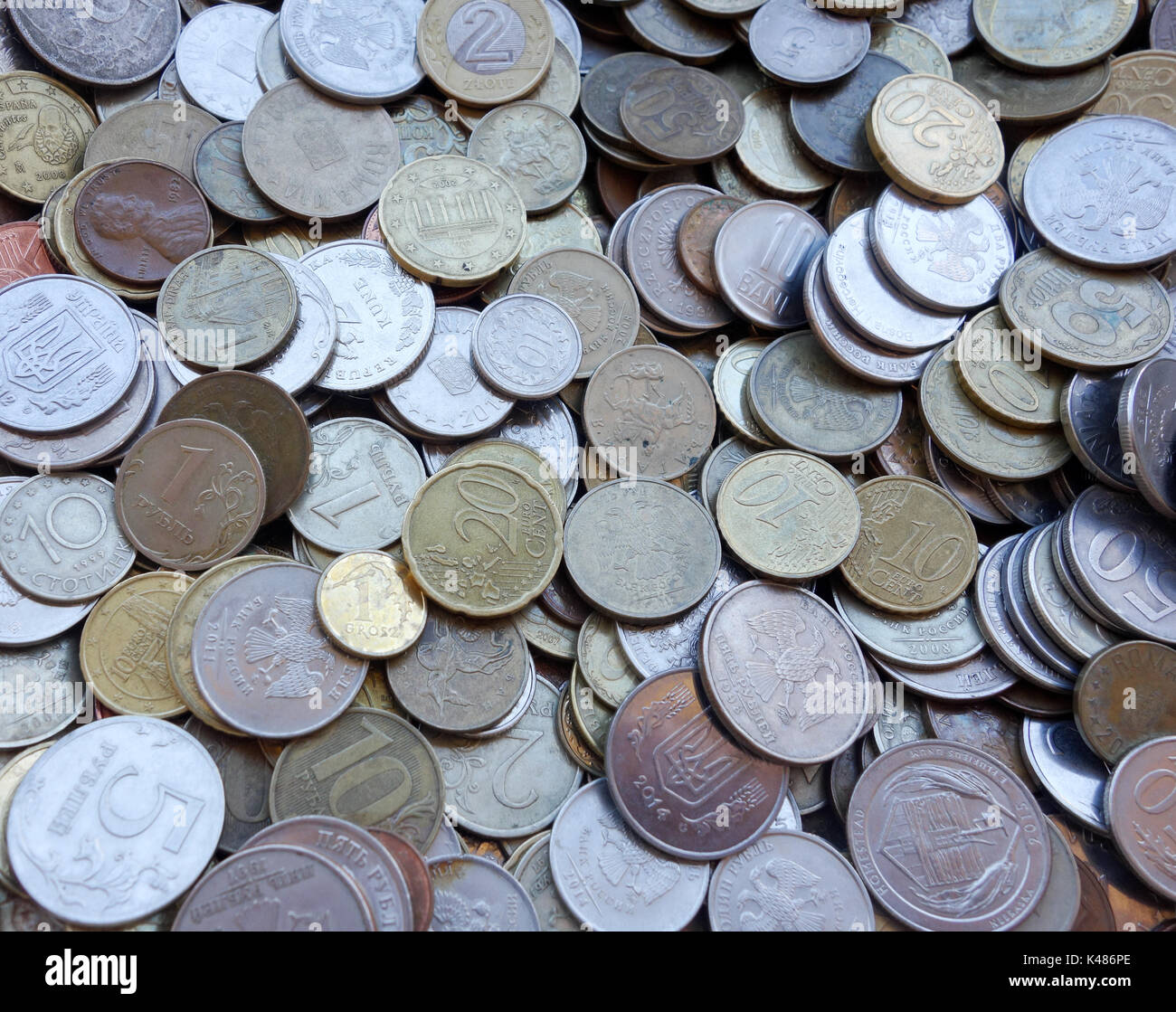 pile of world coins Stock Photo - Alamy