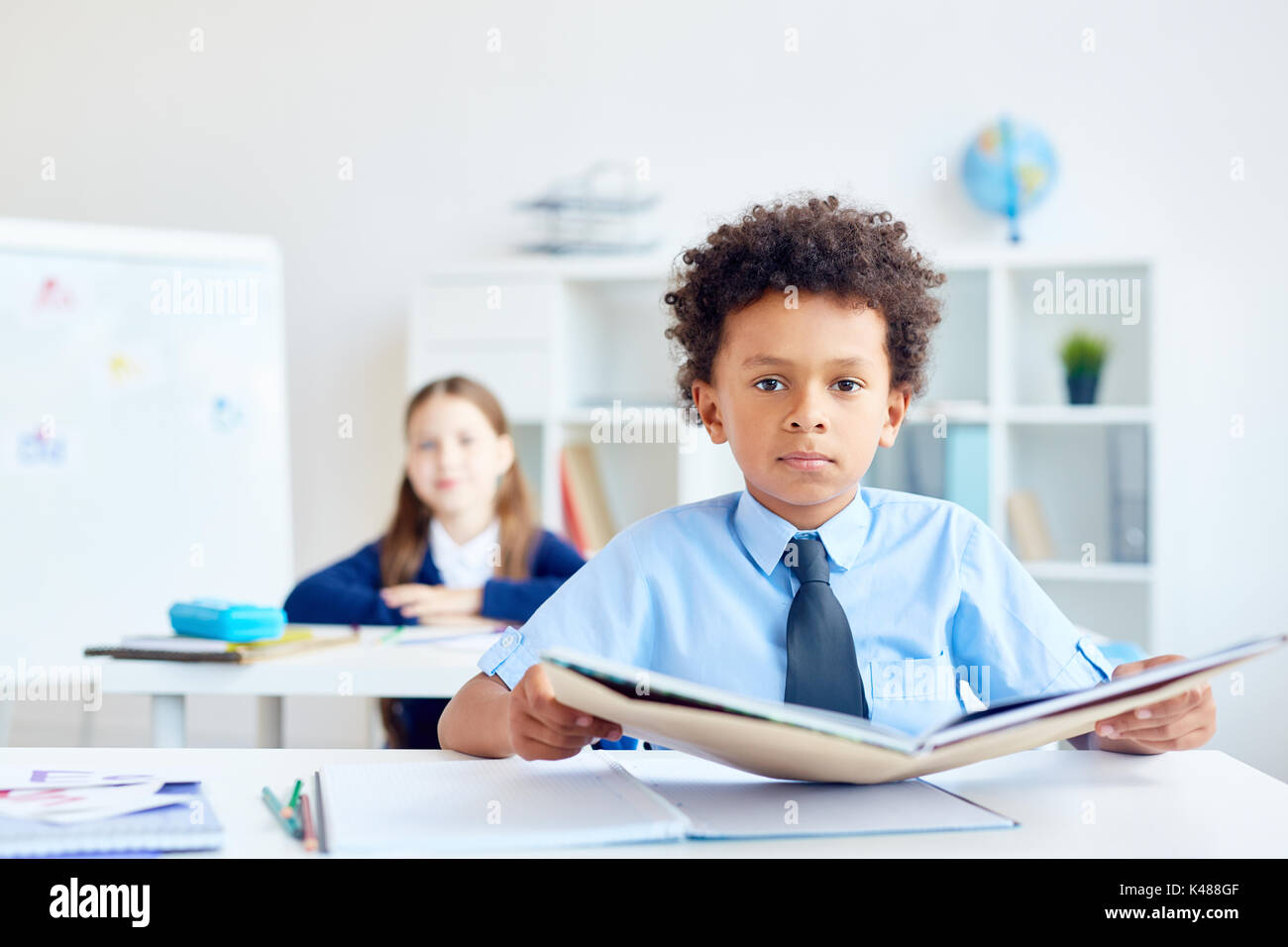 Boy at lesson of reading Stock Photo - Alamy