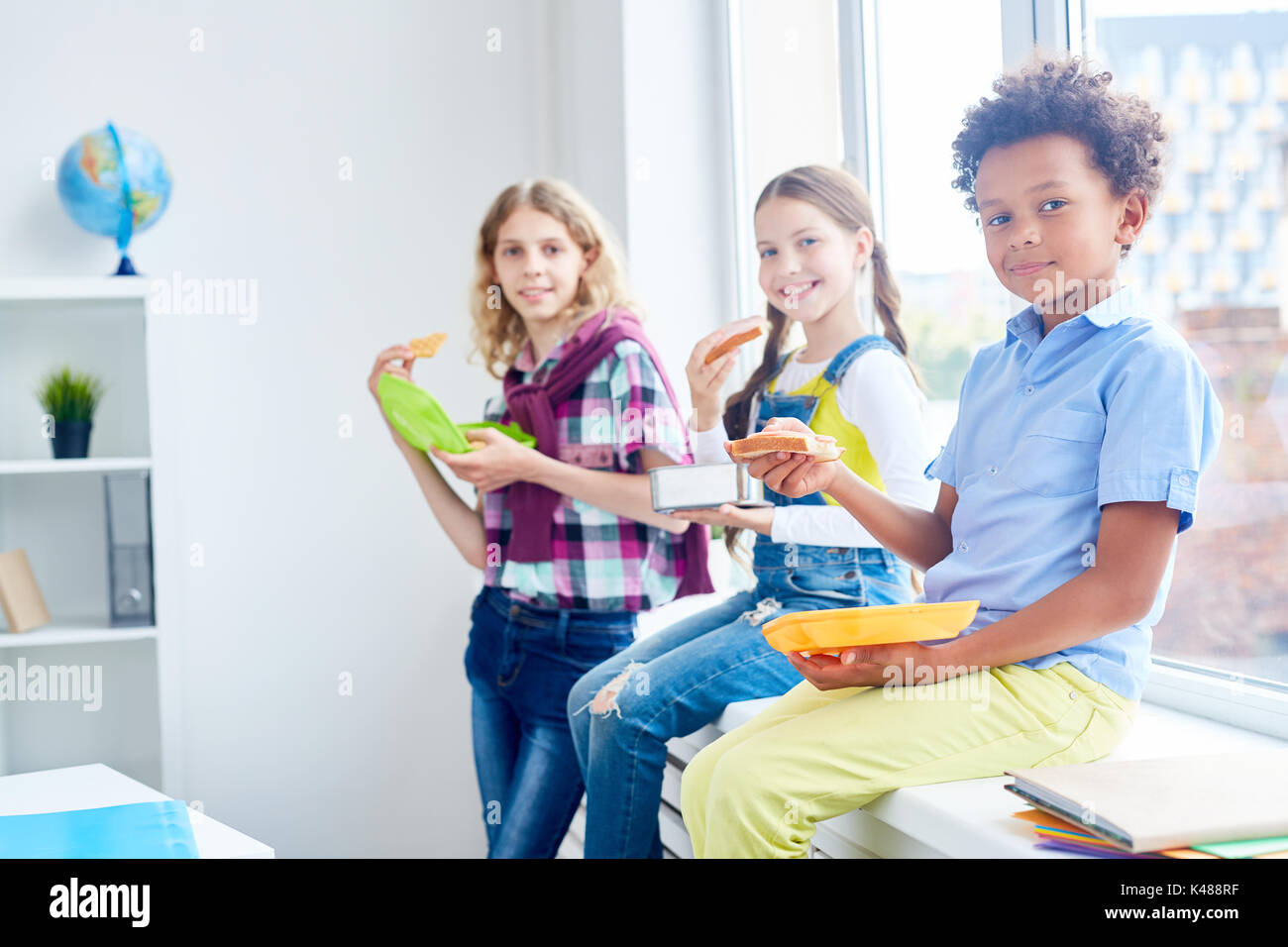 Eating after lesson Stock Photo - Alamy