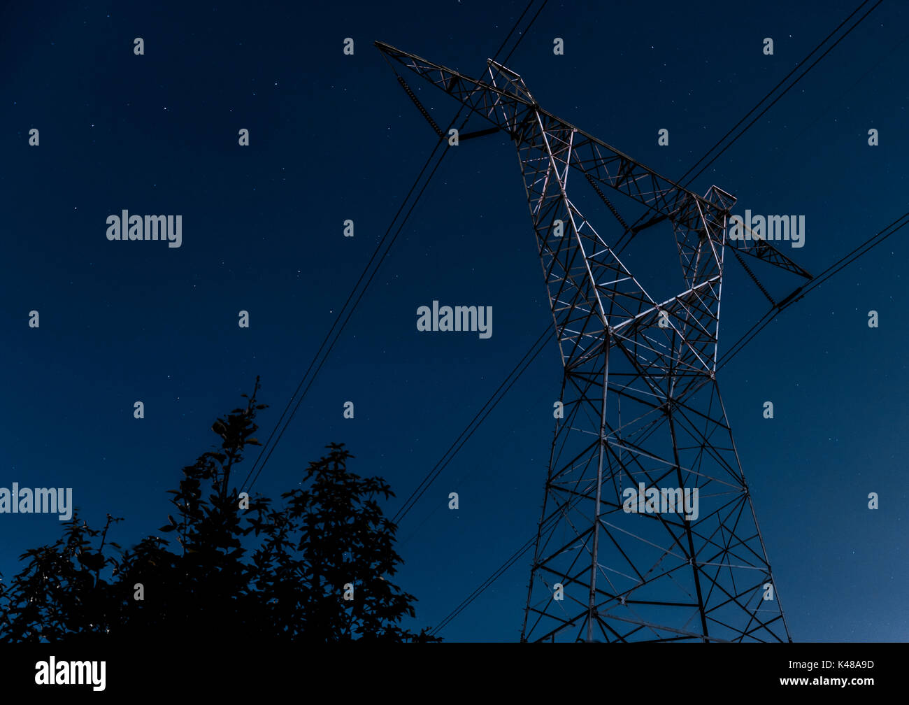 Electric pole night background Stock Photo - Alamy