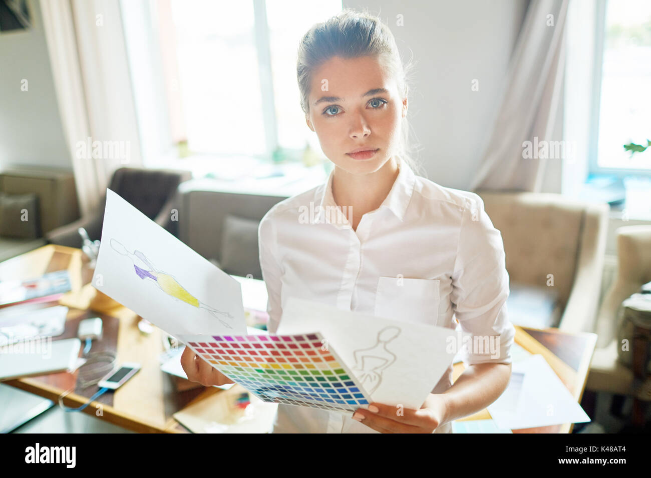 Fashion Designer Wrapped up in Work Stock Photo - Alamy