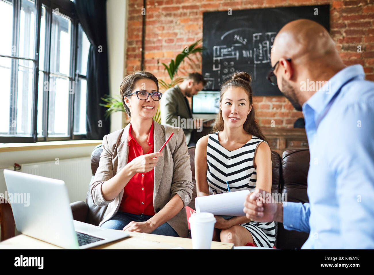 Analyzing Work Results with Colleagues Stock Photo - Alamy
