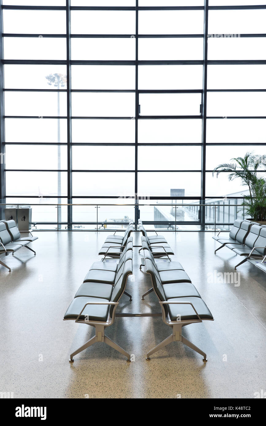 Empty airport terminal waiting area with chairs Stock Photo - Alamy