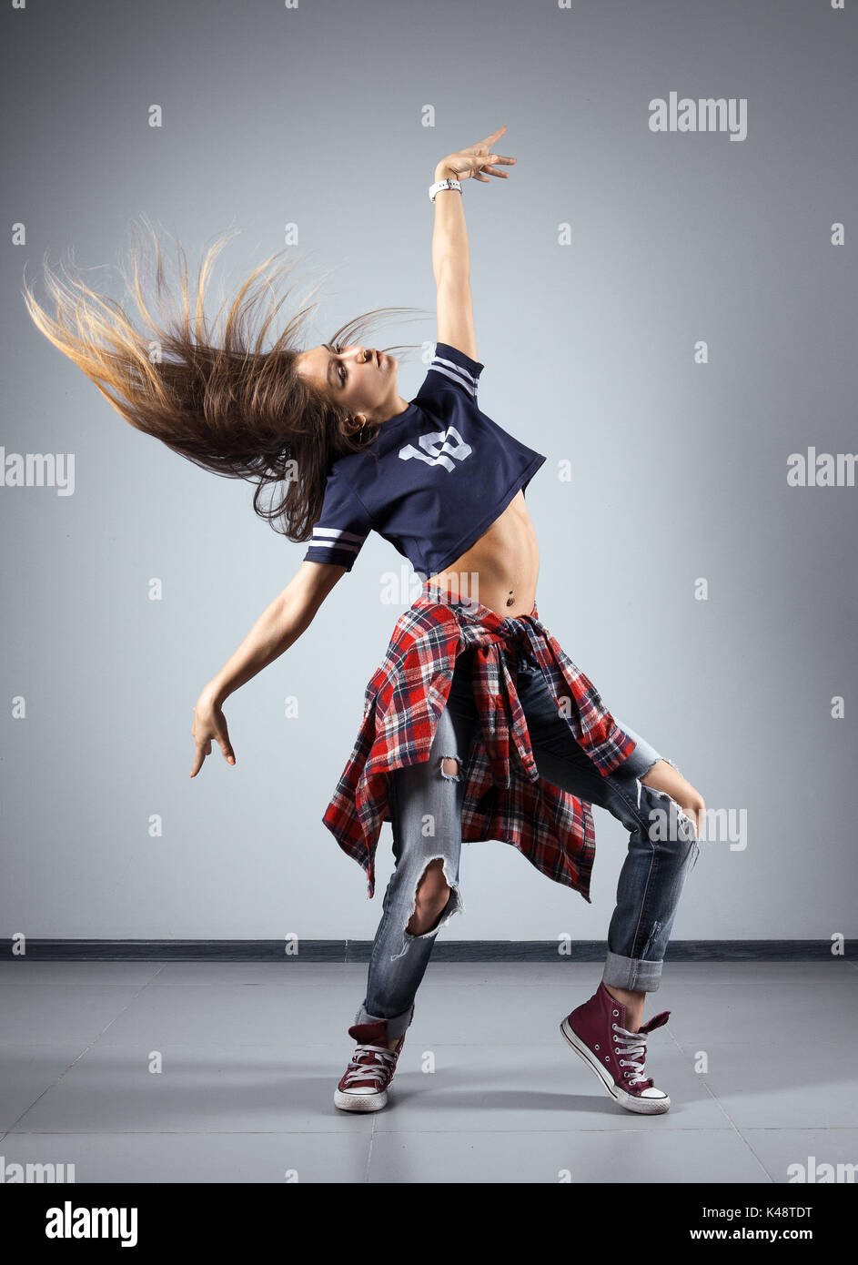 modern young beautiful dancer posing on a studio background Stock Photo ...