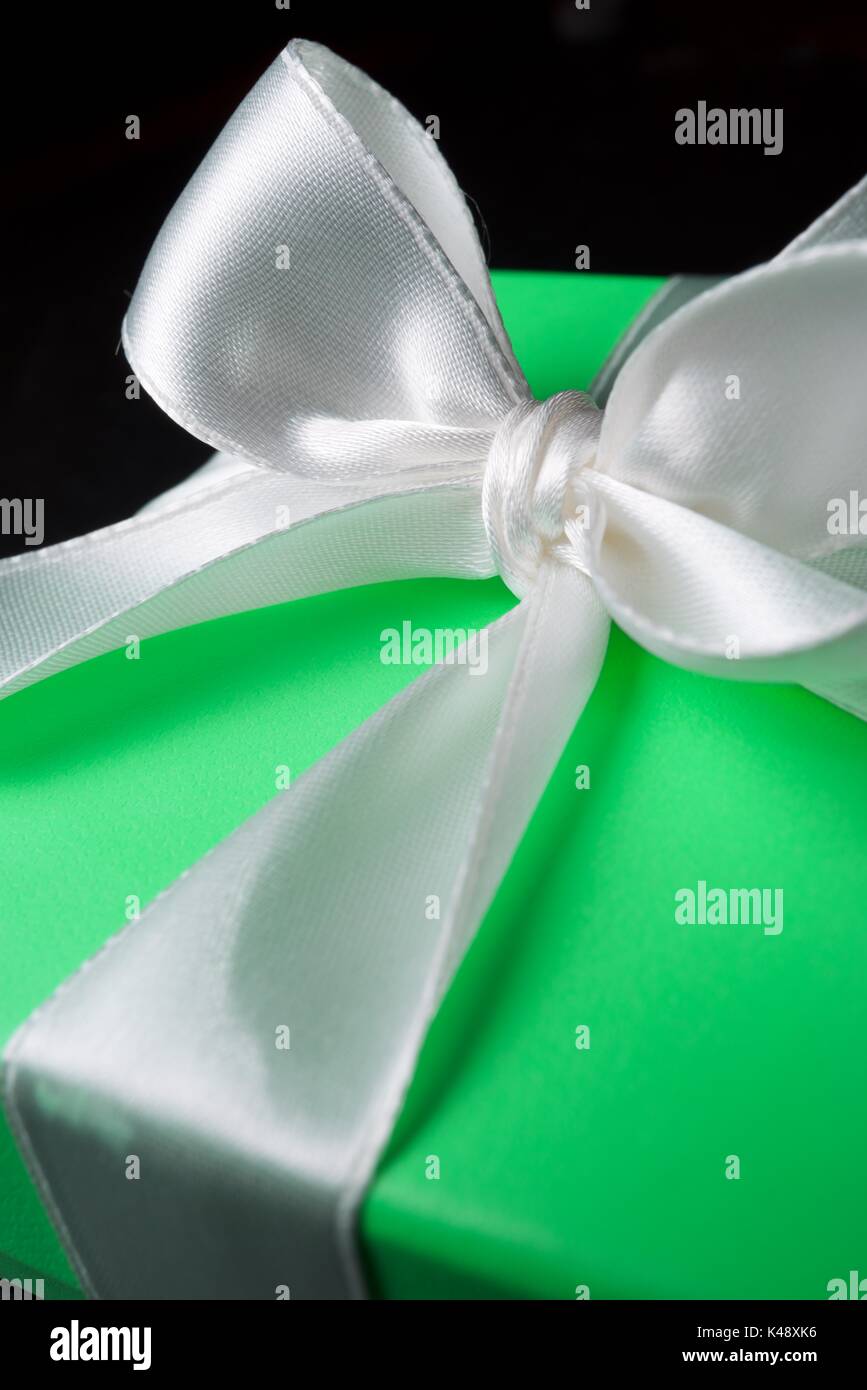 Luxury box tied with a white ribbon Stock Photo - Alamy