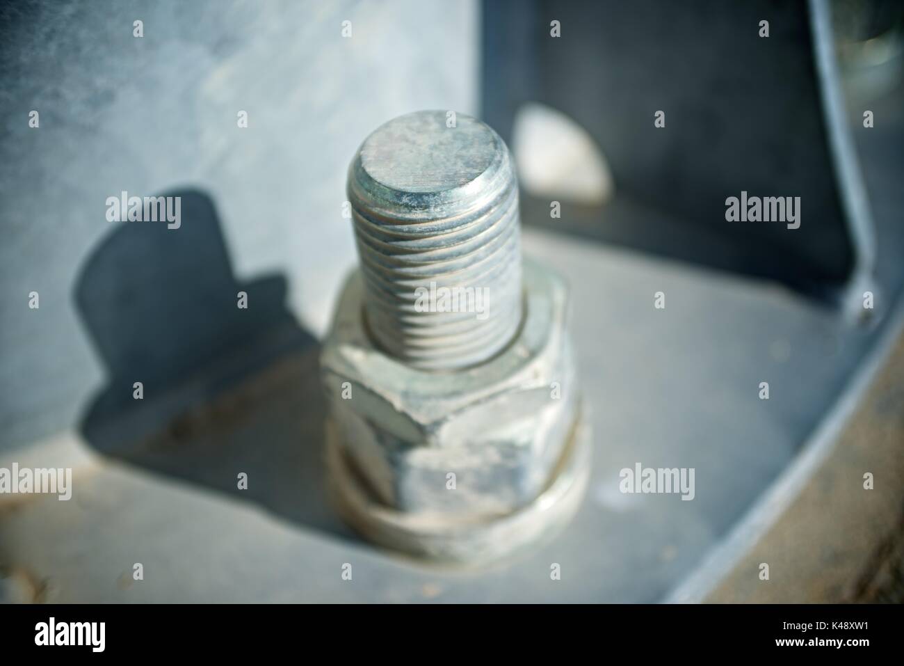 Close up of a larger screw into the base of a metal pillar Stock Photo ...