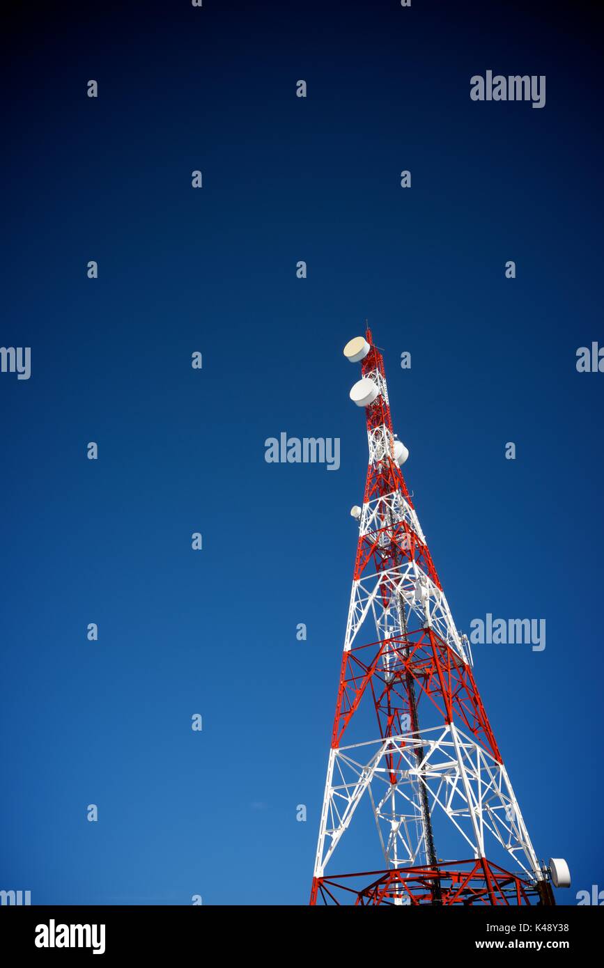 Telecommunications tower with clear blue sky Stock Photo - Alamy