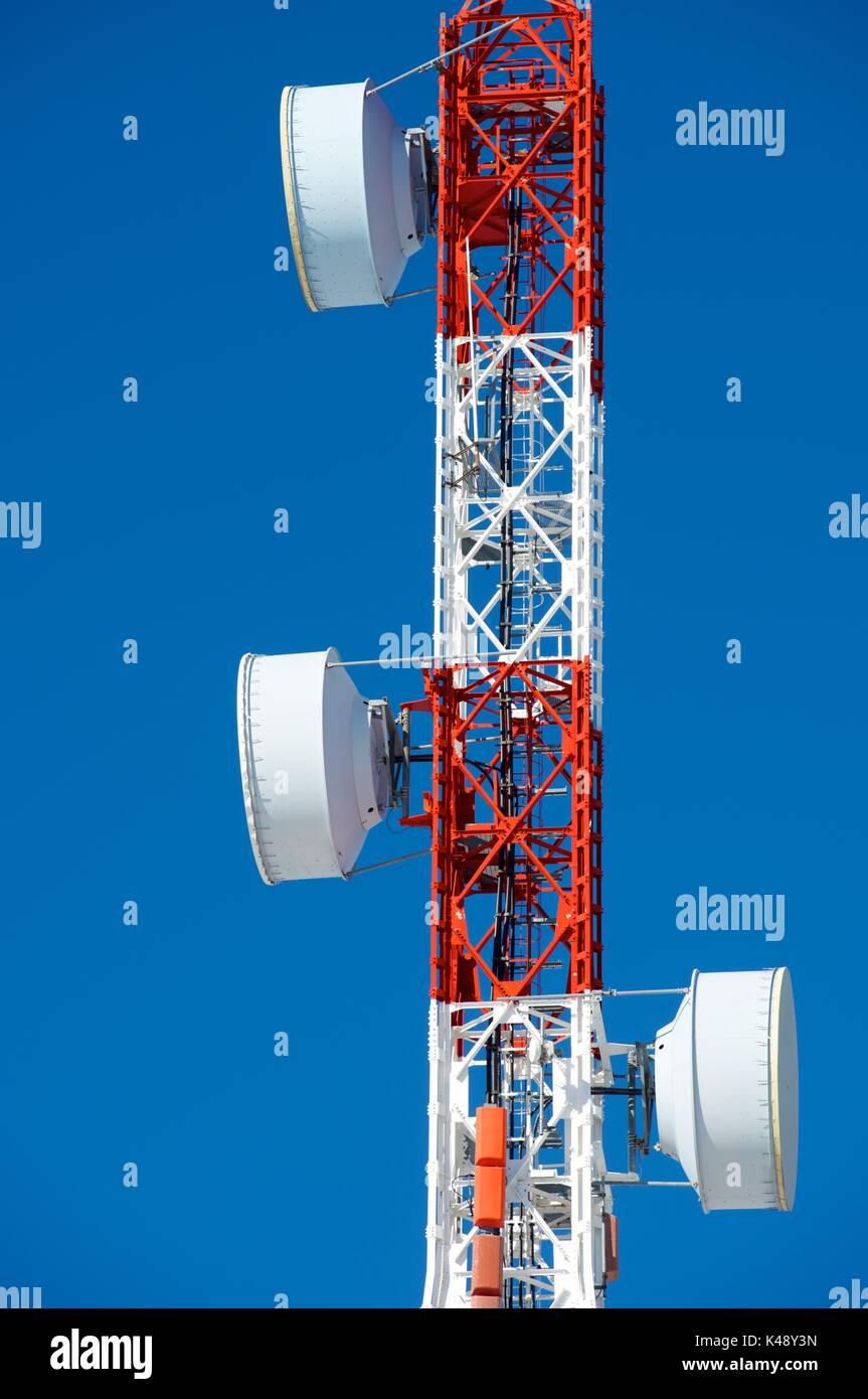 Telecommunications tower with clear blue sky Stock Photo - Alamy