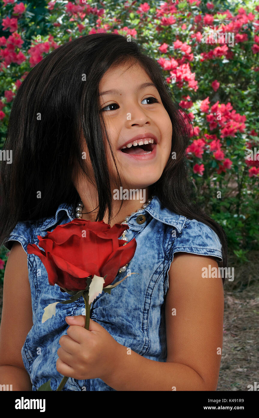 Little girl holding a fresh cut rose Stock Photo - Alamy