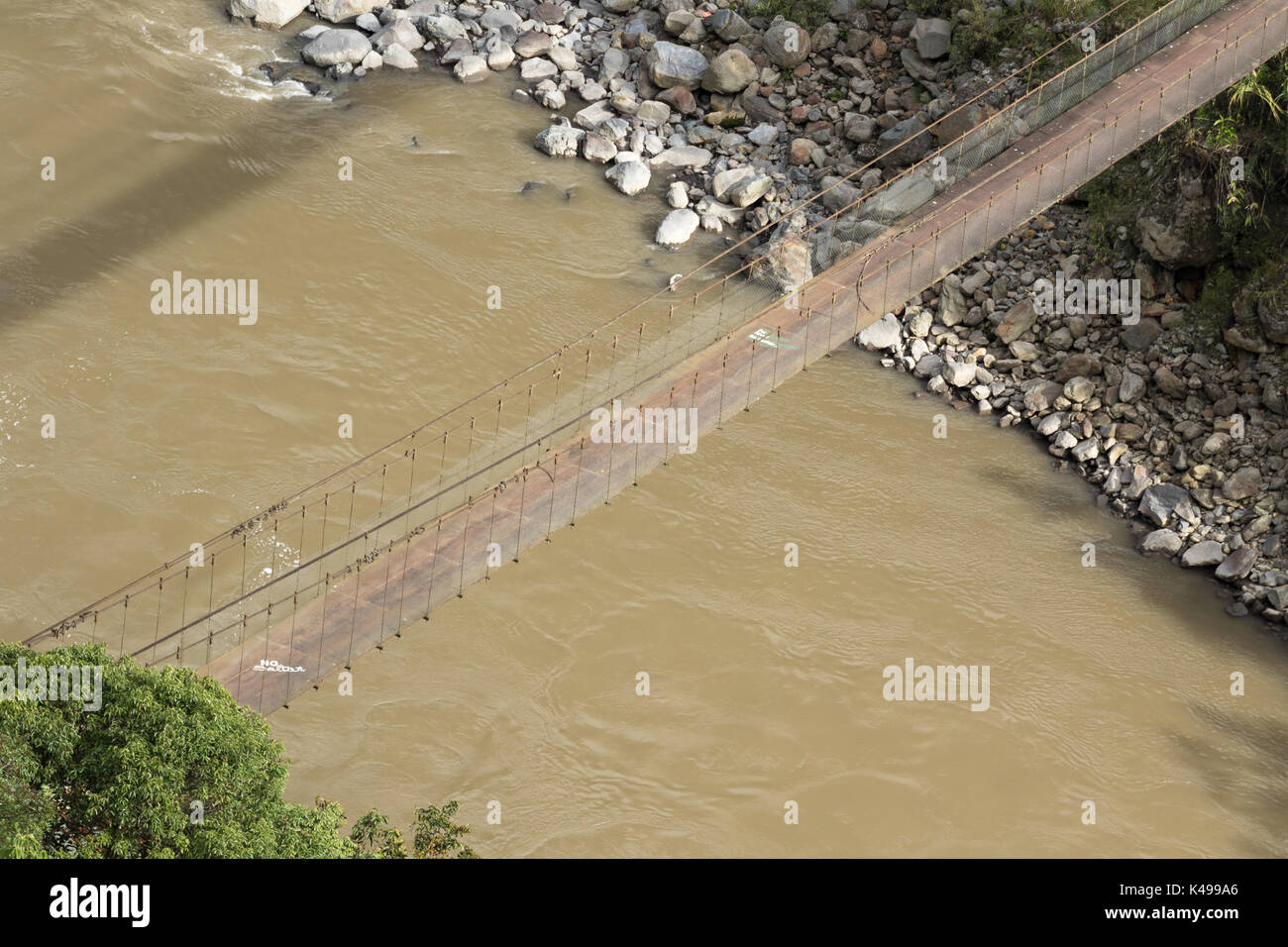 cable suspension bridge across river in Banos Ecuador Stock Photo - Alamy