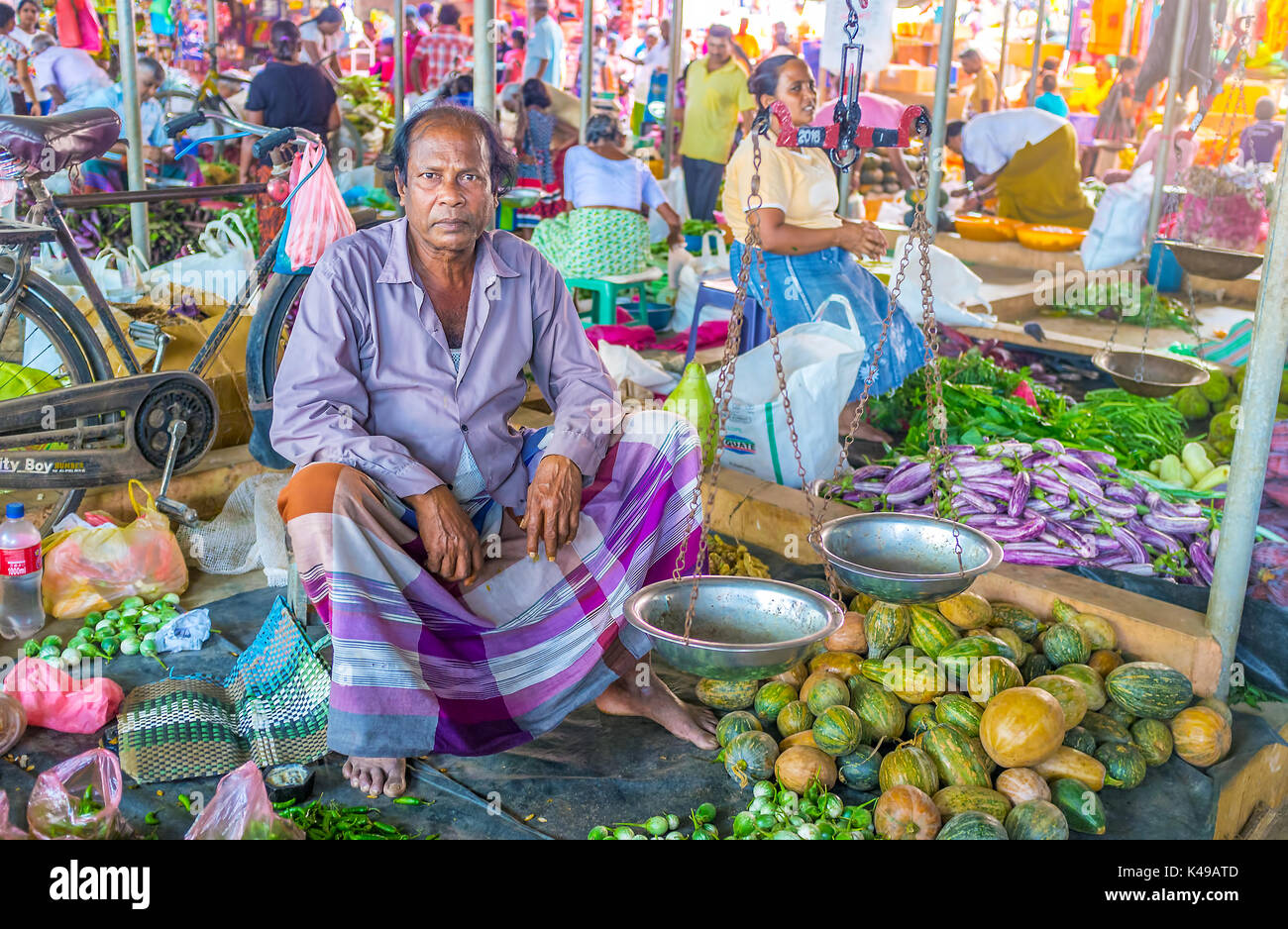 WELLAWAYA, SRI LANKA - DECEMBER 2, 2016: The sad merchant dressed in ...