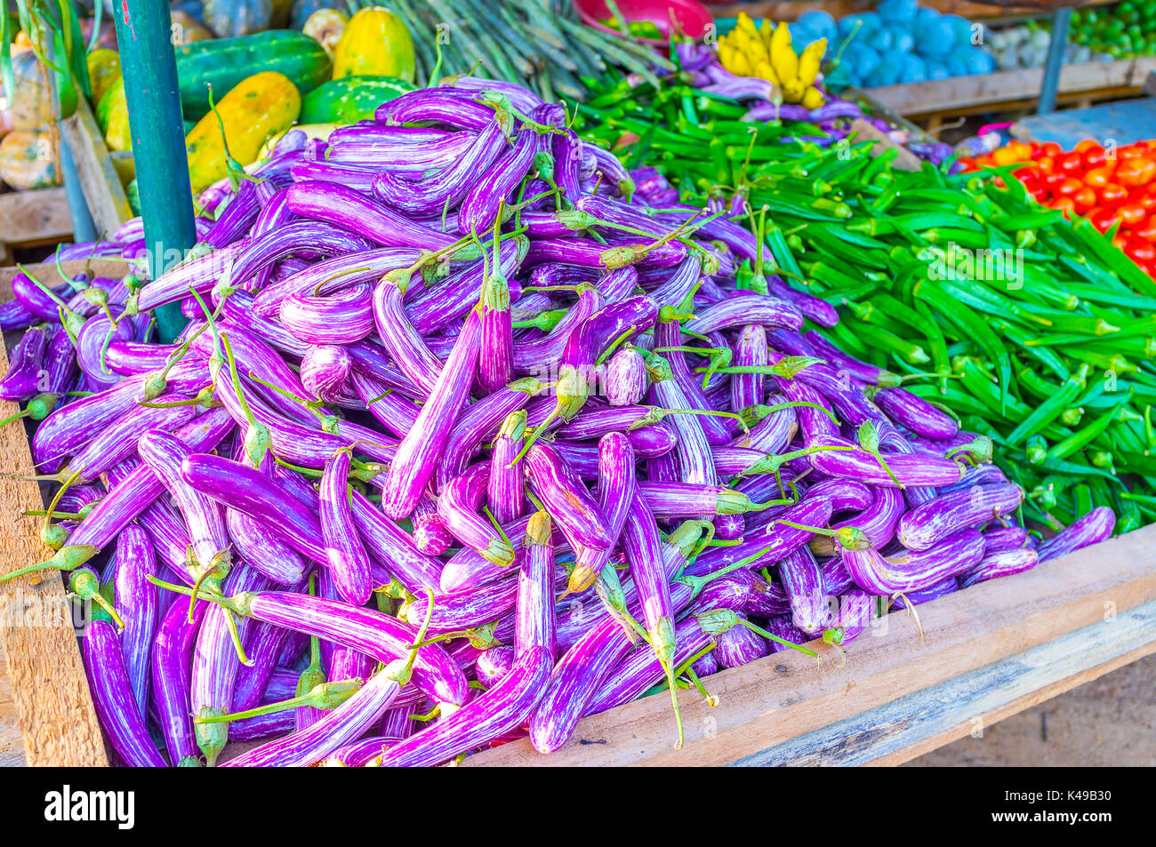 The heap of graffiti eggplants in roadside market stall in Kuda Oya ...