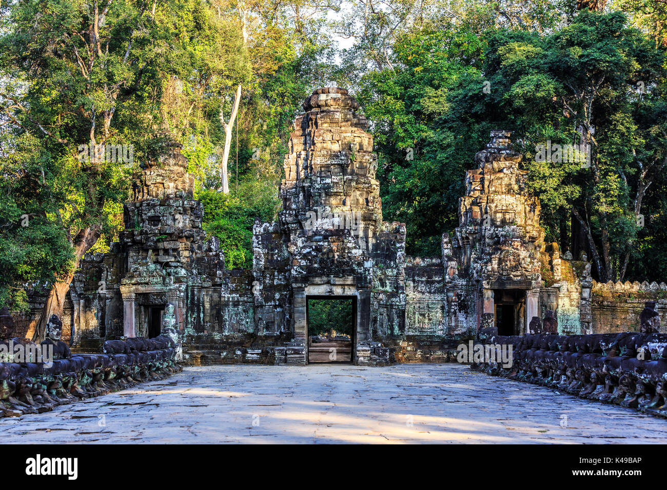 Ancient stone door in ruins of buddhist khmer temple near Siem Reap ...