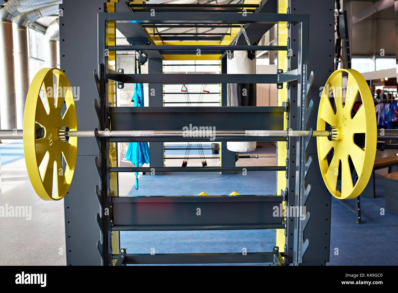 Barbell on a rack in a sports gym Stock Photo - Alamy
