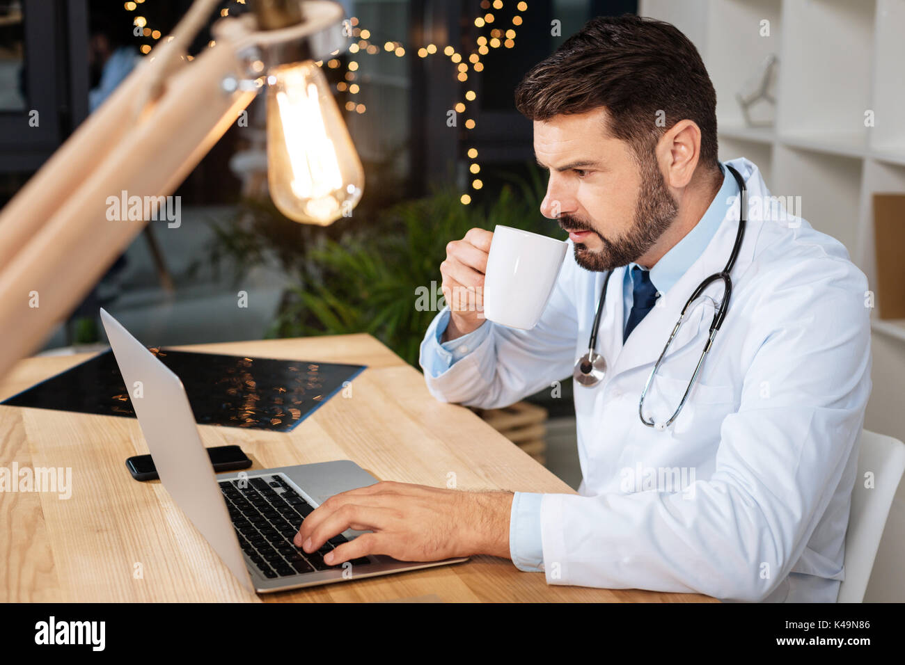 Smart handsome doctor using hi-res stock photography and images - Alamy