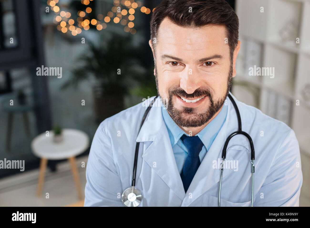 Cheerful handsome man looking at you Stock Photo - Alamy