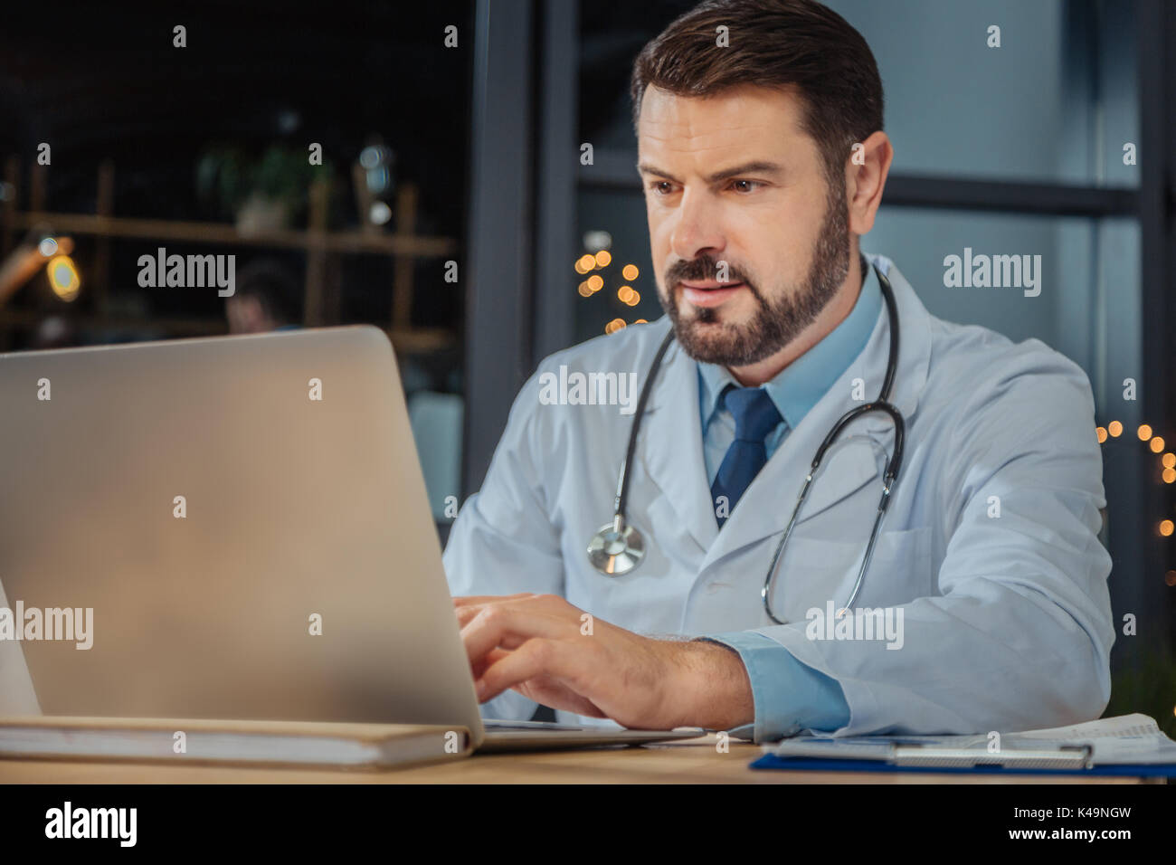 Nice smart man concentrating on his work Stock Photo - Alamy