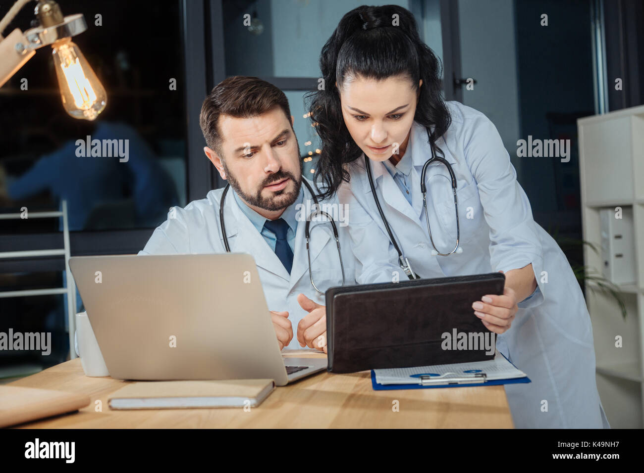 Smart professional scientists looking at the tablet screen Stock Photo ...