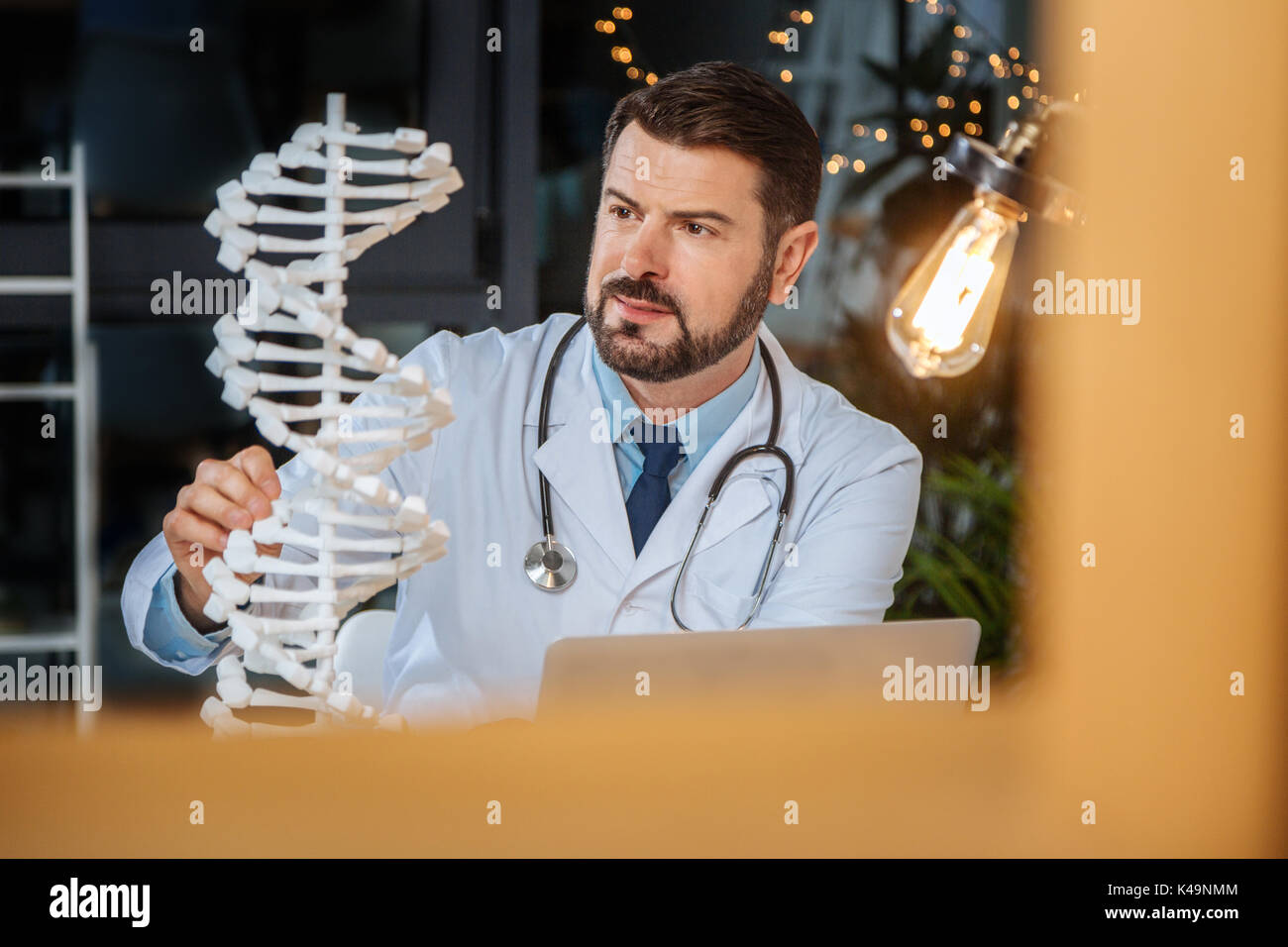 Intelligent handsome scientist doing a research Stock Photo - Alamy