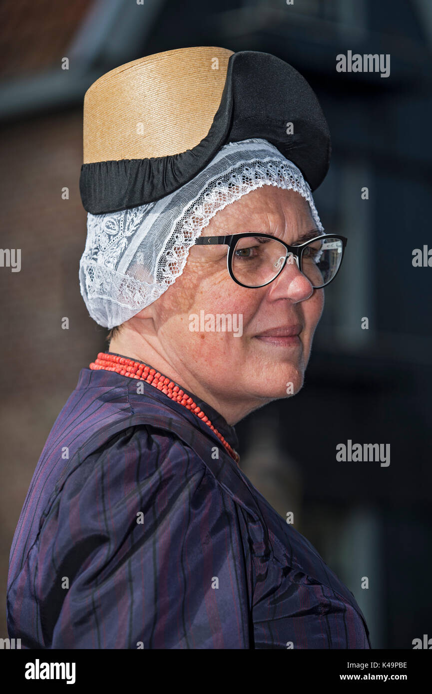 Woman Wearing A Traditional Dutch Costume Complemented By A White Lace ...