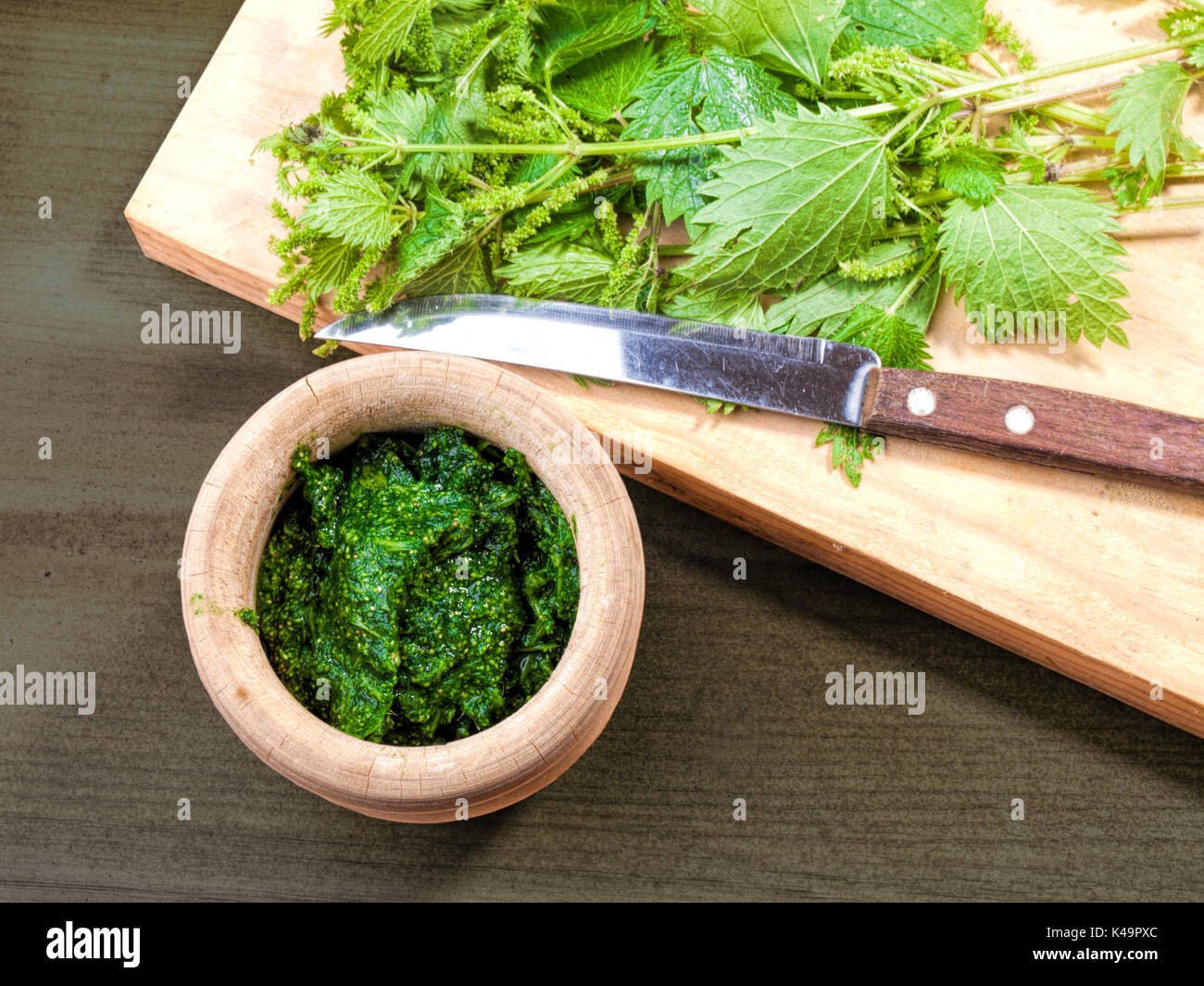 Cooked And Raw Nettles On A Wooden Board And In A Rustic Mortar Stock ...