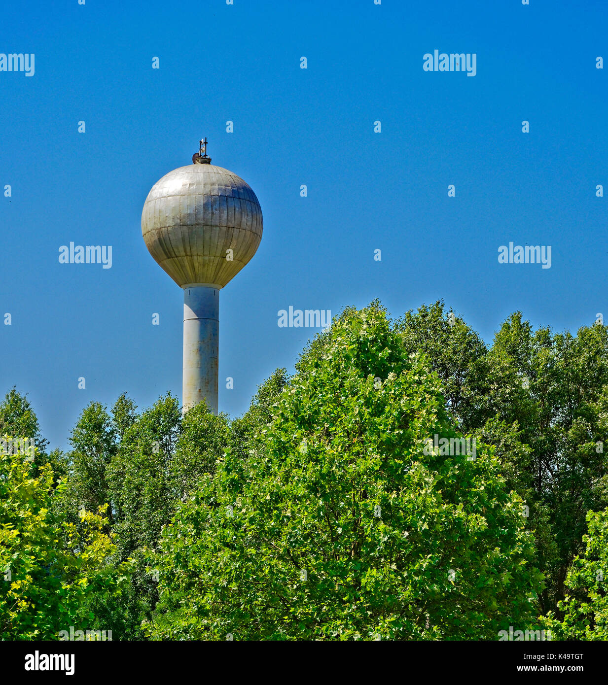 Silver Water Tower Behind Trees Stock Photo - Alamy