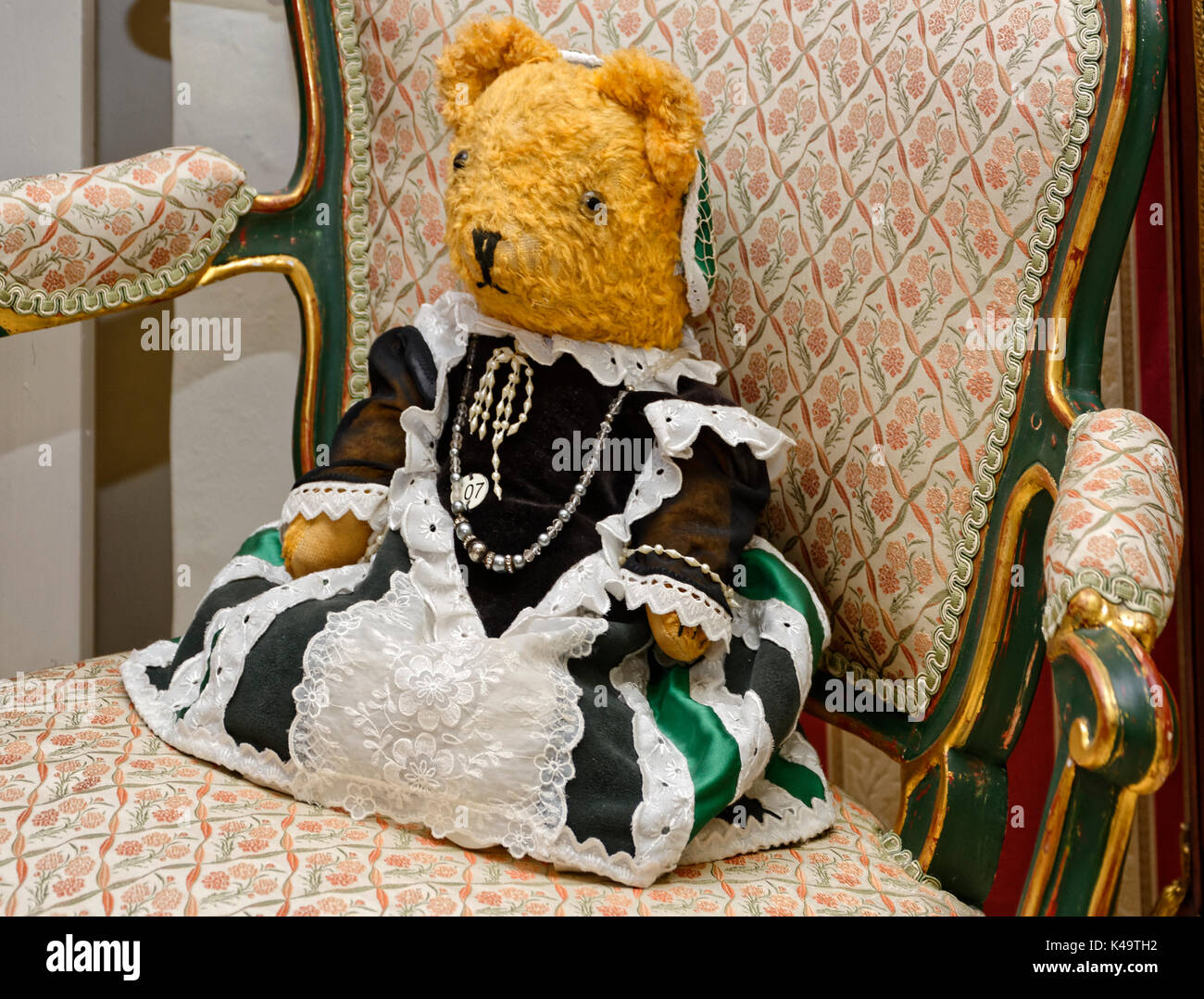 Teddy Bear Lady Sitting Fine On A Upholstered Chair Stock Photo - Alamy