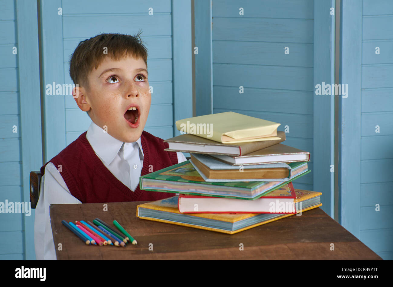 Little child stressed tired leaning on pile of books, vintage concept ...