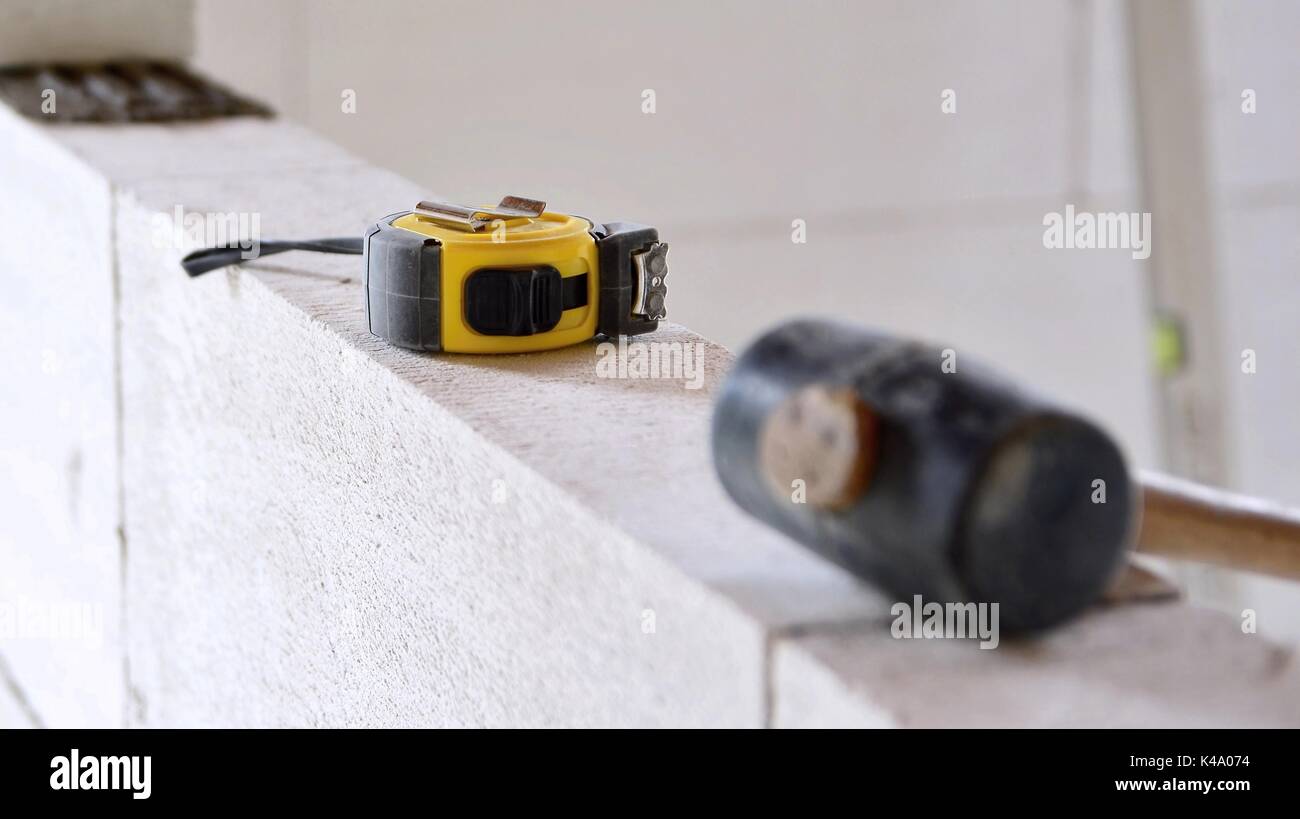 Work tools put on a autoclaved aerated concrete blocks wall Stock Photo ...