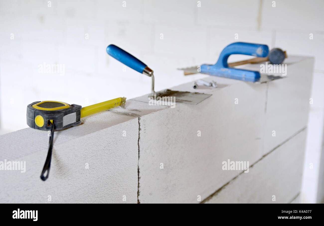 Work tools put on a autoclaved aerated concrete blocks wall Stock Photo ...