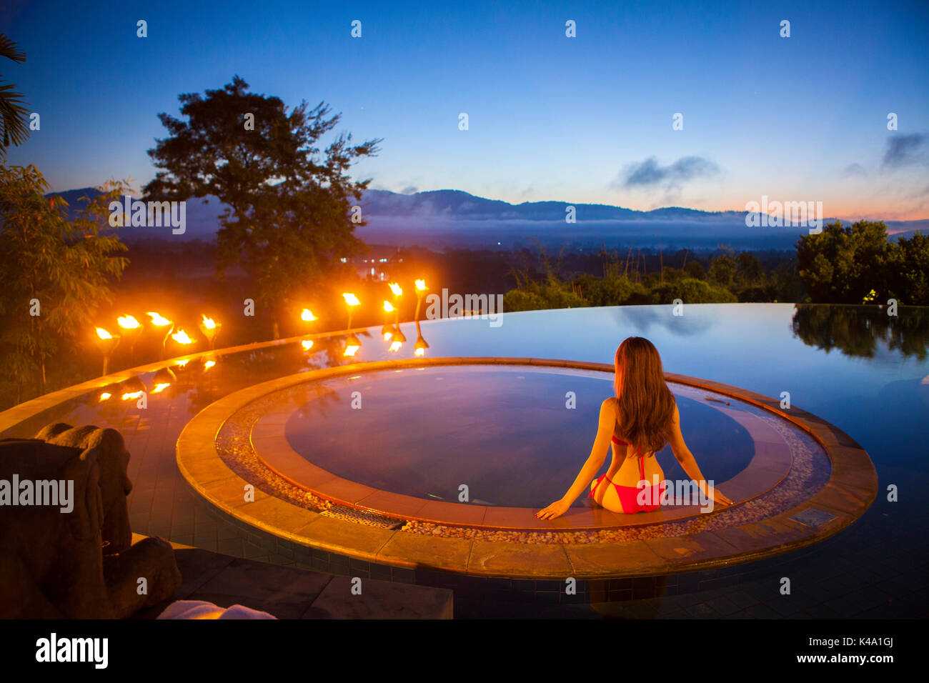 Woman relaxing in infinity hi-res stock photography and images - Alamy